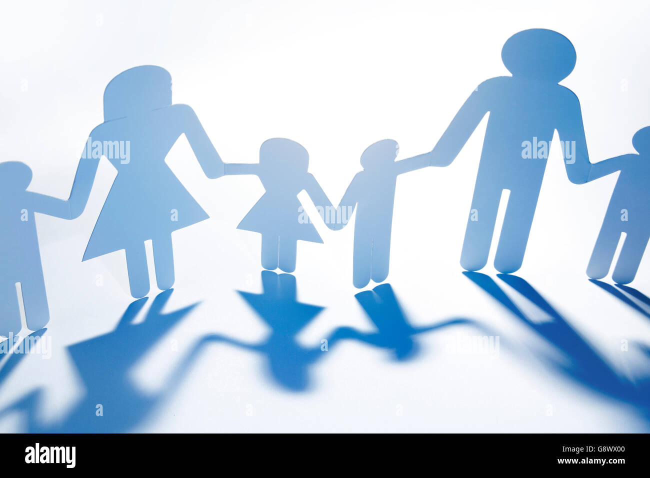 Family paper chain cutout holding hands Stock Photo - Alamy