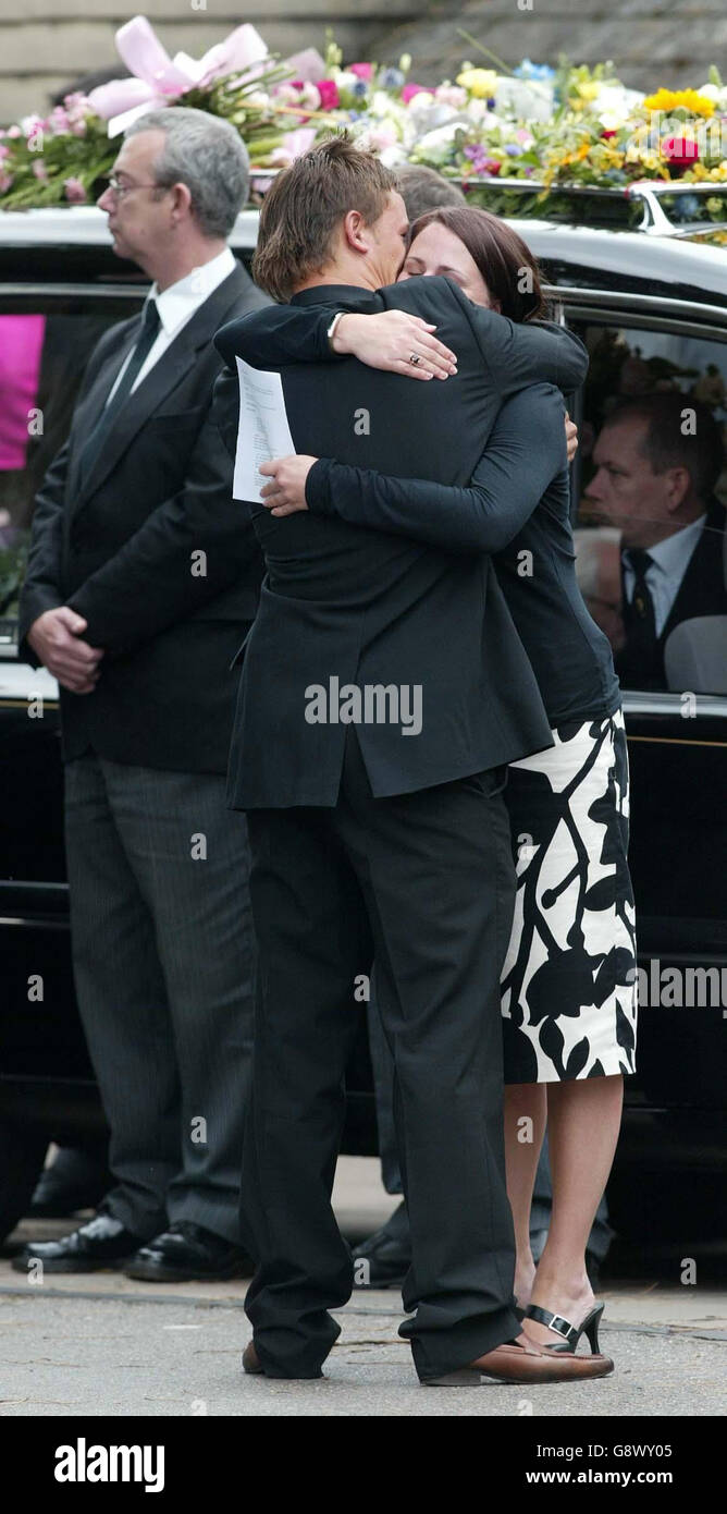 Mourners leave the funeral service at St.Augustine's Catholic Church ...