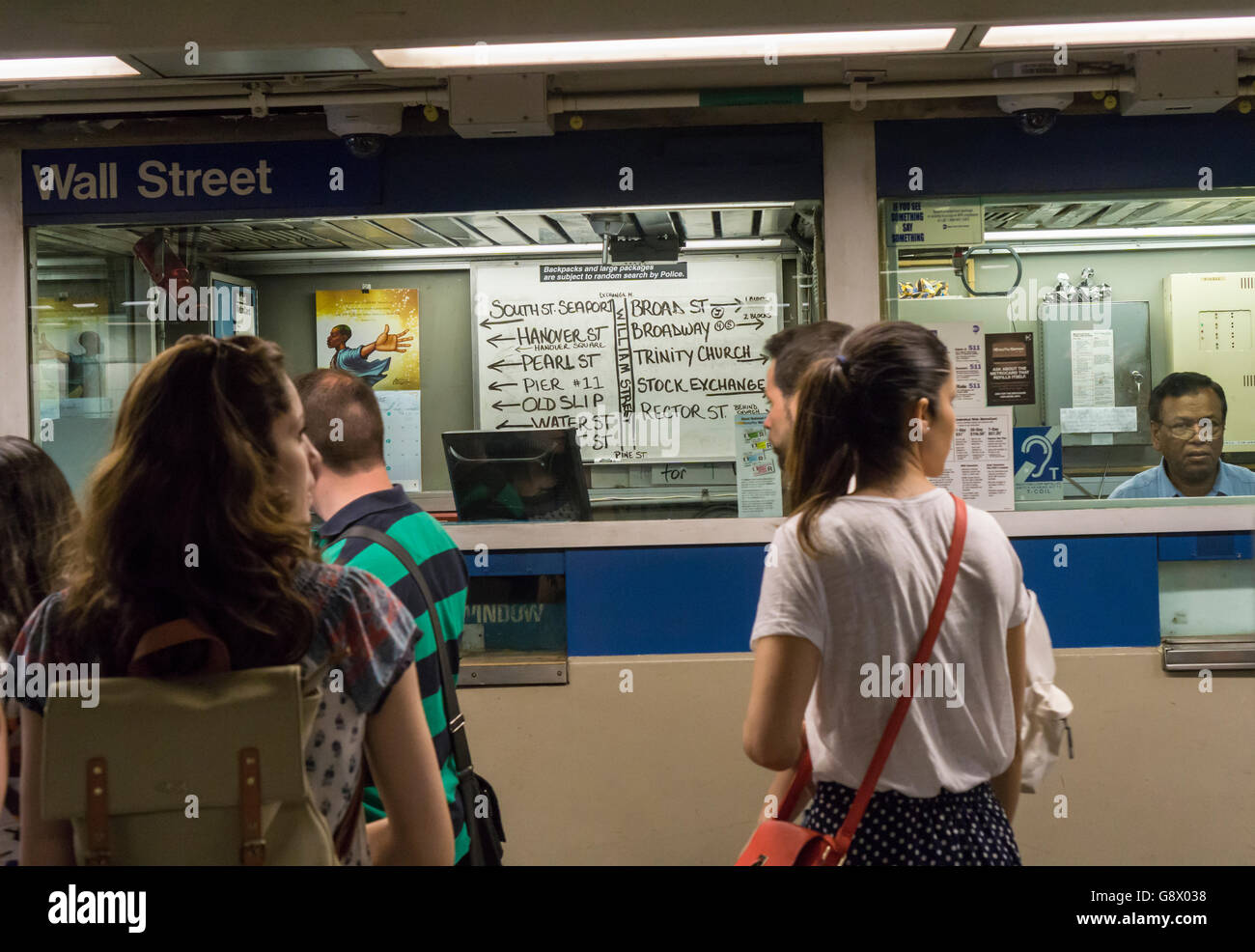 A token booth at the Wall Street station in New York displays a sign ...