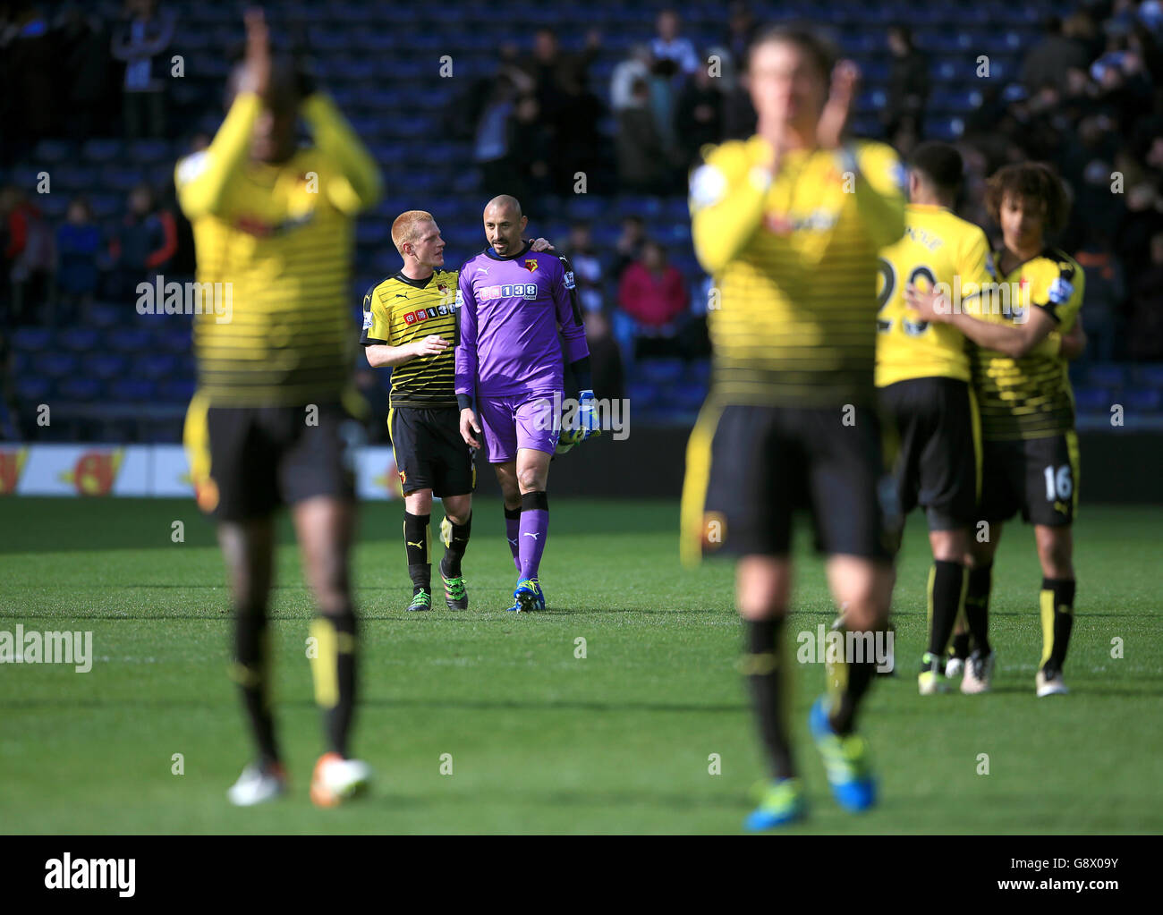 Watford's (left) Ben Watson and goalkeeper Heurelho Gomes (centre ...
