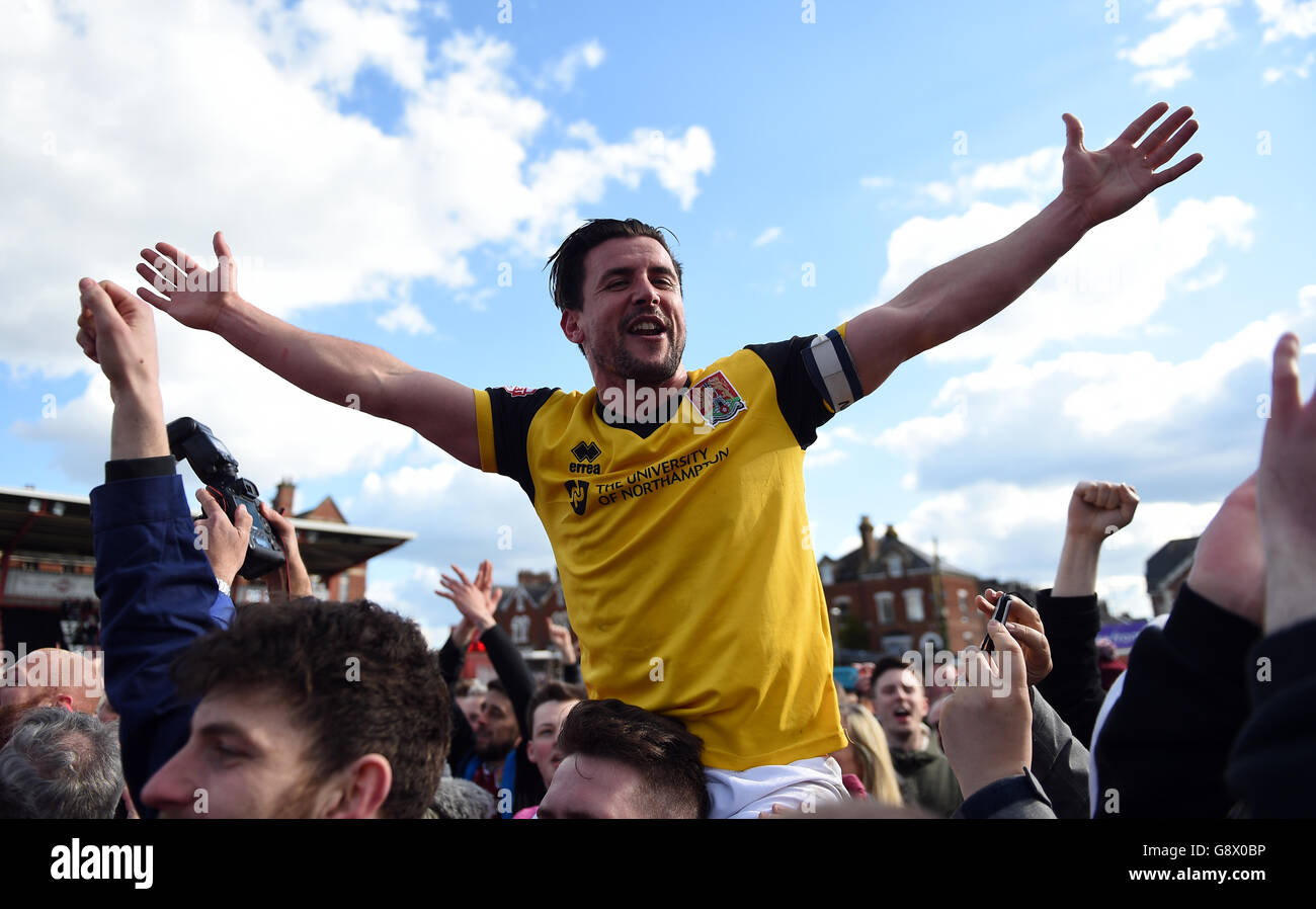 Northampton Town's David Buchanan celebrates with fans after their team ...