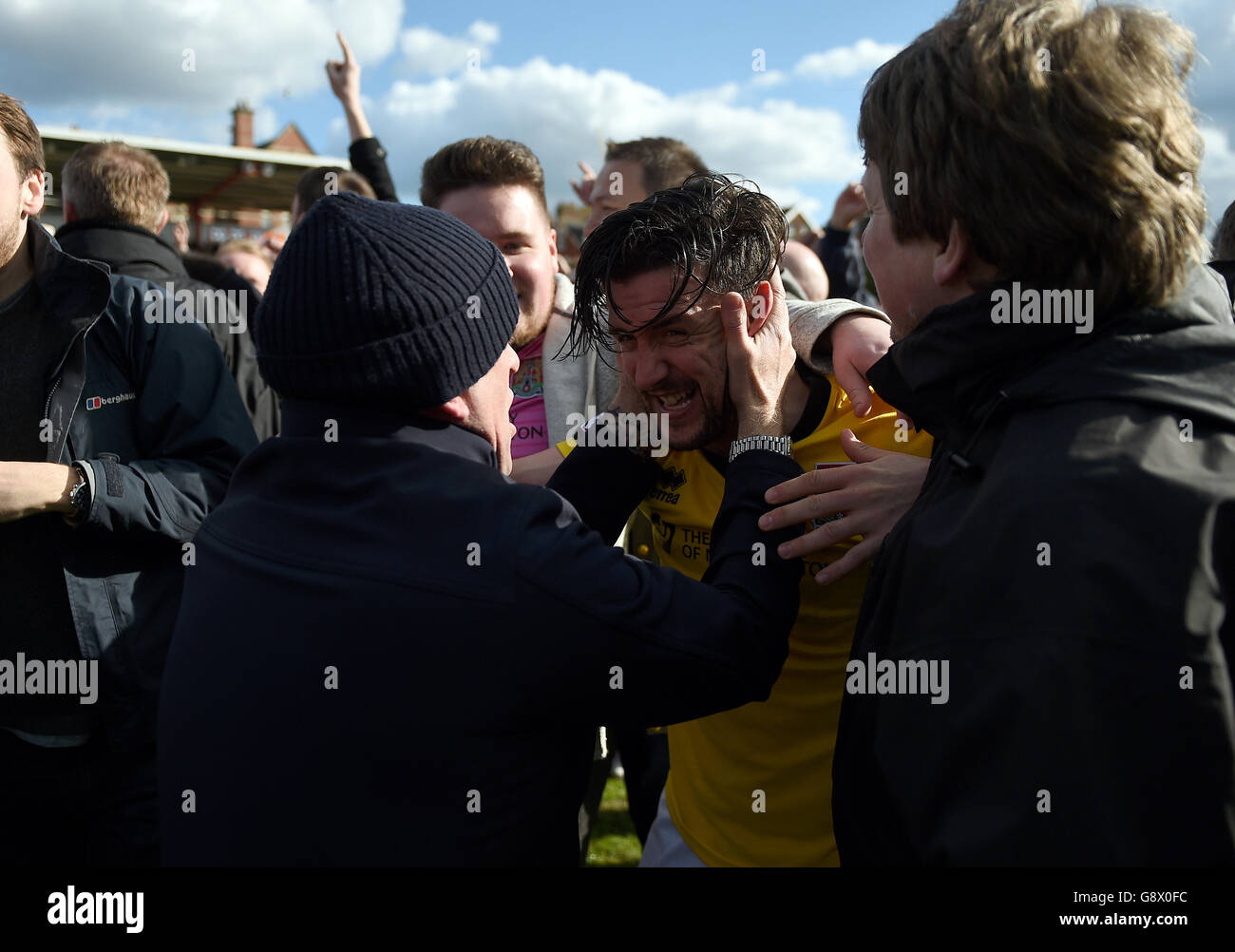Northampton Town's David Buchanan celebrates with fans after their team ...