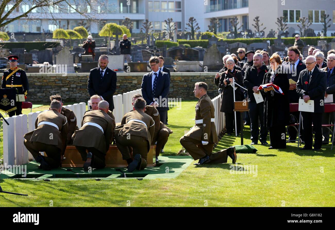 Caroline Rowbottom (second right) watches the coffin of her grandfather ...