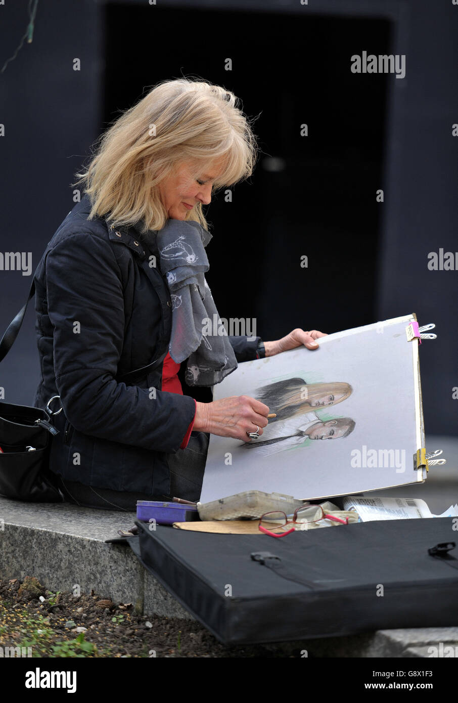 Court artist Elizabeth Cook at work outside the Old Bailey, working on ...