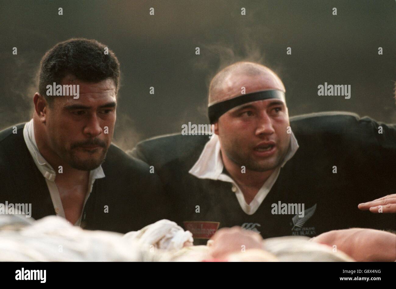 Olo Brown (left) and Norm Hewitt (right) of New Zealand let off steam ...