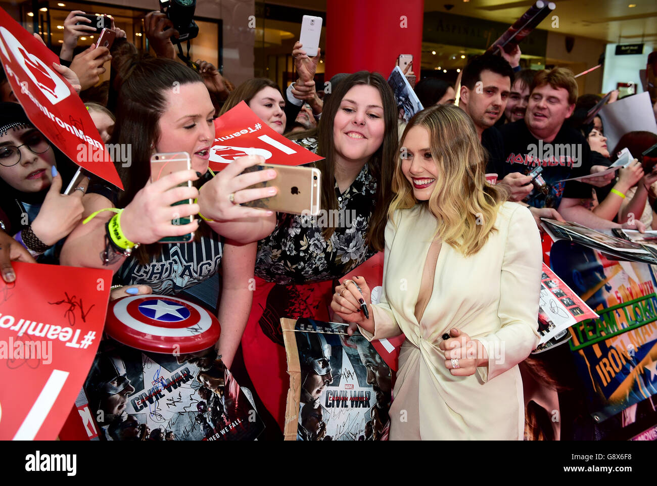 Elizabeth olsen poses with fans during the captain america hi-res stock ...