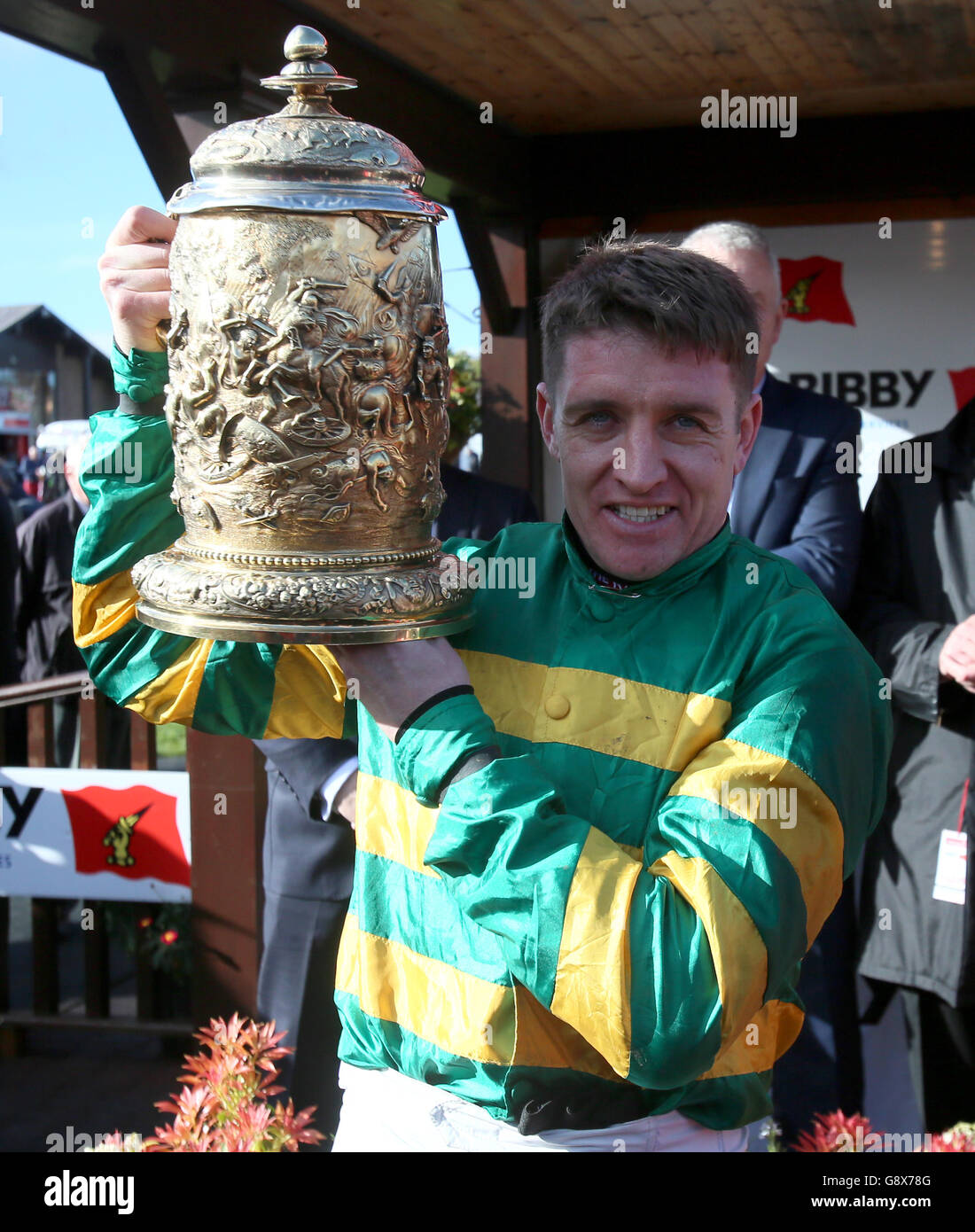 Jockey Barry Geraghty celebrates winning the Bibby Financial Services ...
