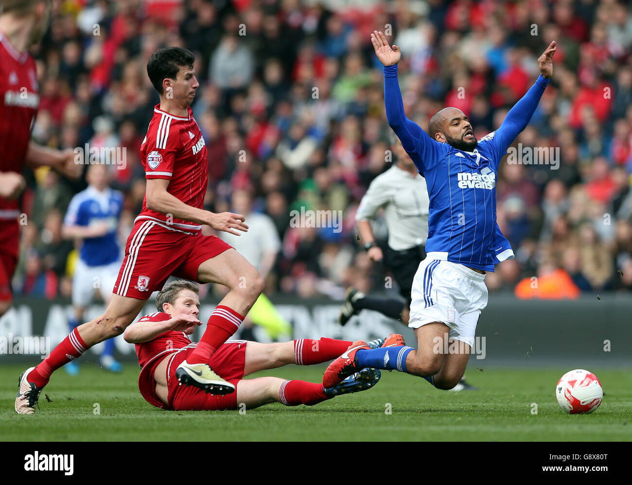 Middlesbrough's captain Grant Leadbitter (bottom left) tackles Ipswich ...