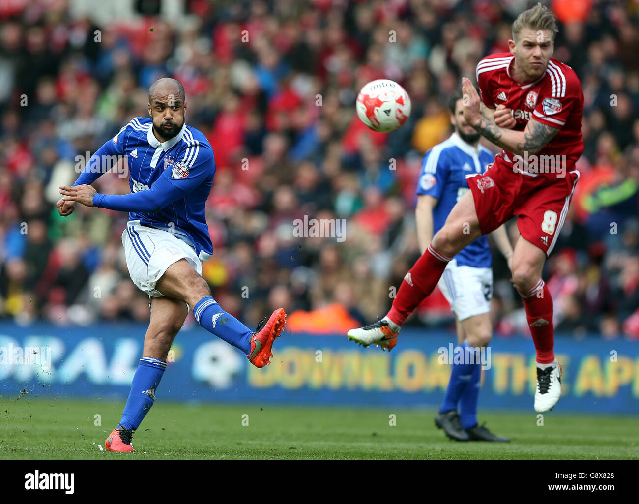 Ipswich Town's David McGoldrick (left) has a shot towards goal past ...