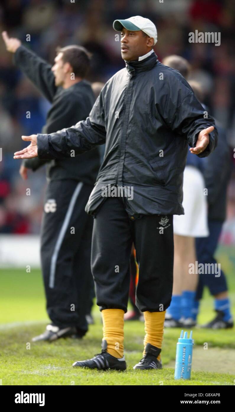Lincoln City's manager Keith Alexander looks puzzled about the 2nd goal ...