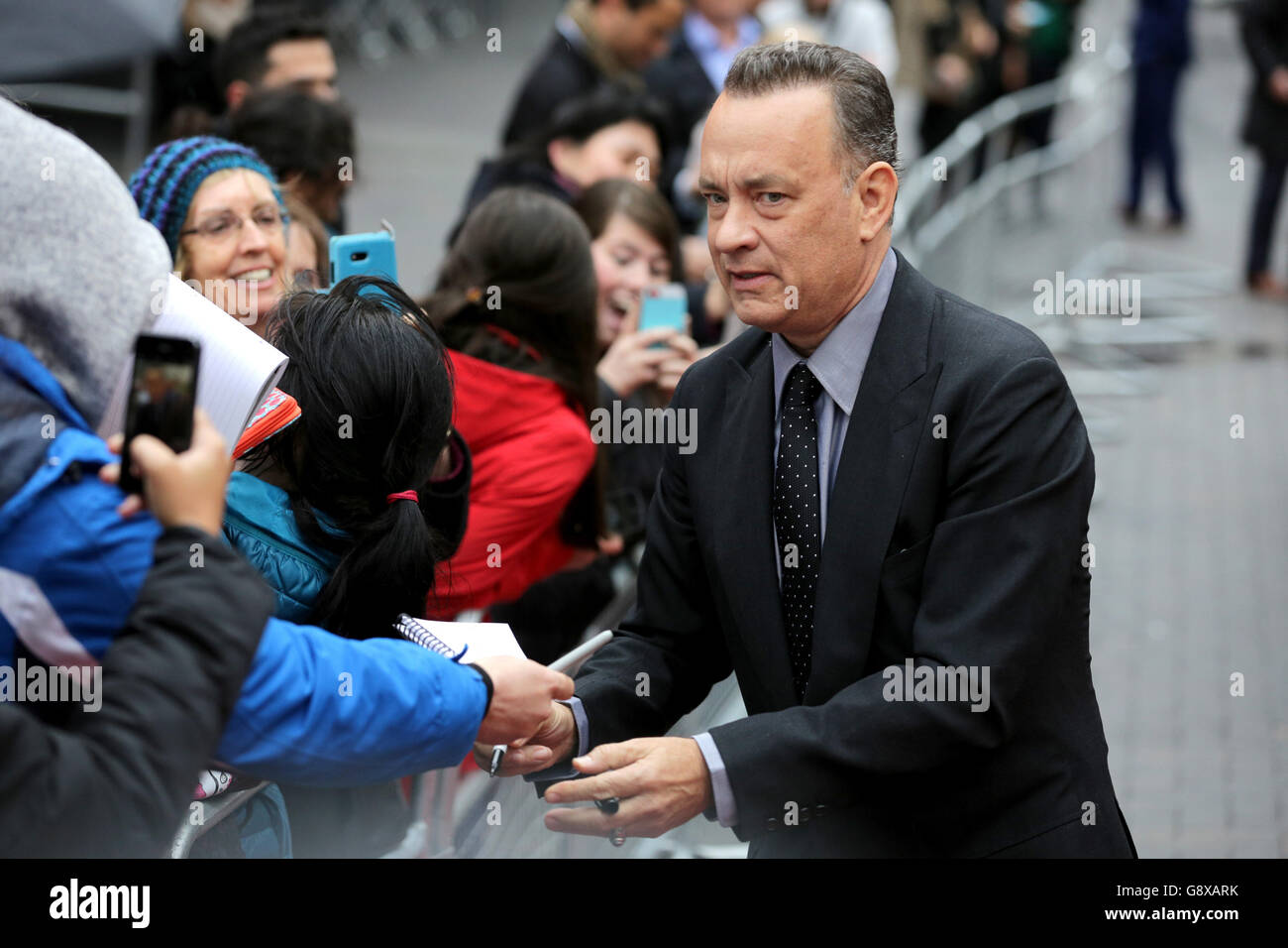 Tom Hanks signs autographs for fans whilst attending the A Hologram For ...