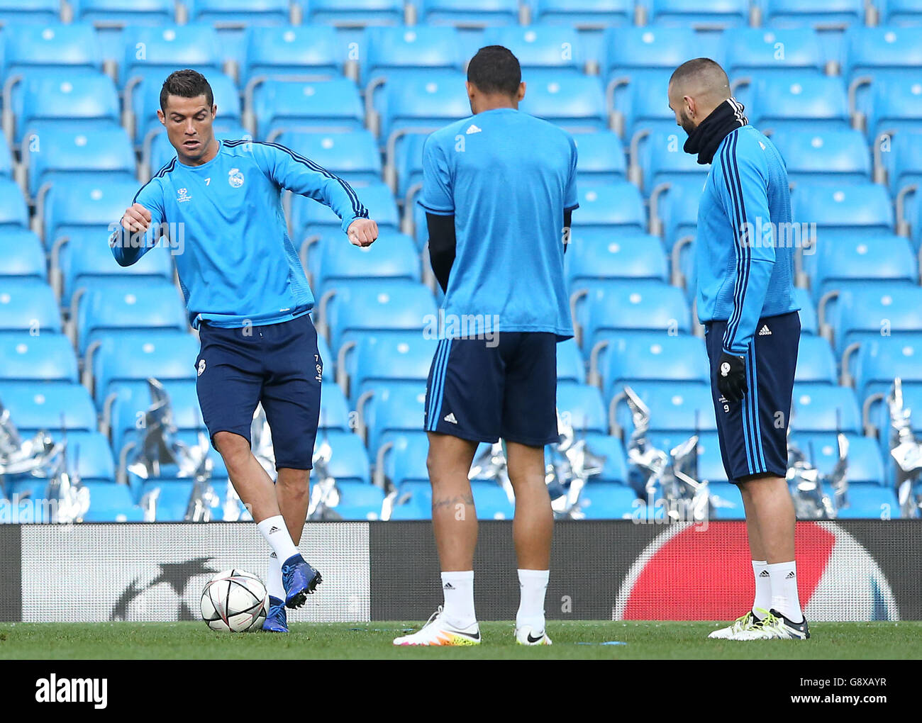 Real Madrid's Cristiano Ronaldo (left) with Raphael Varane (centre) and ...