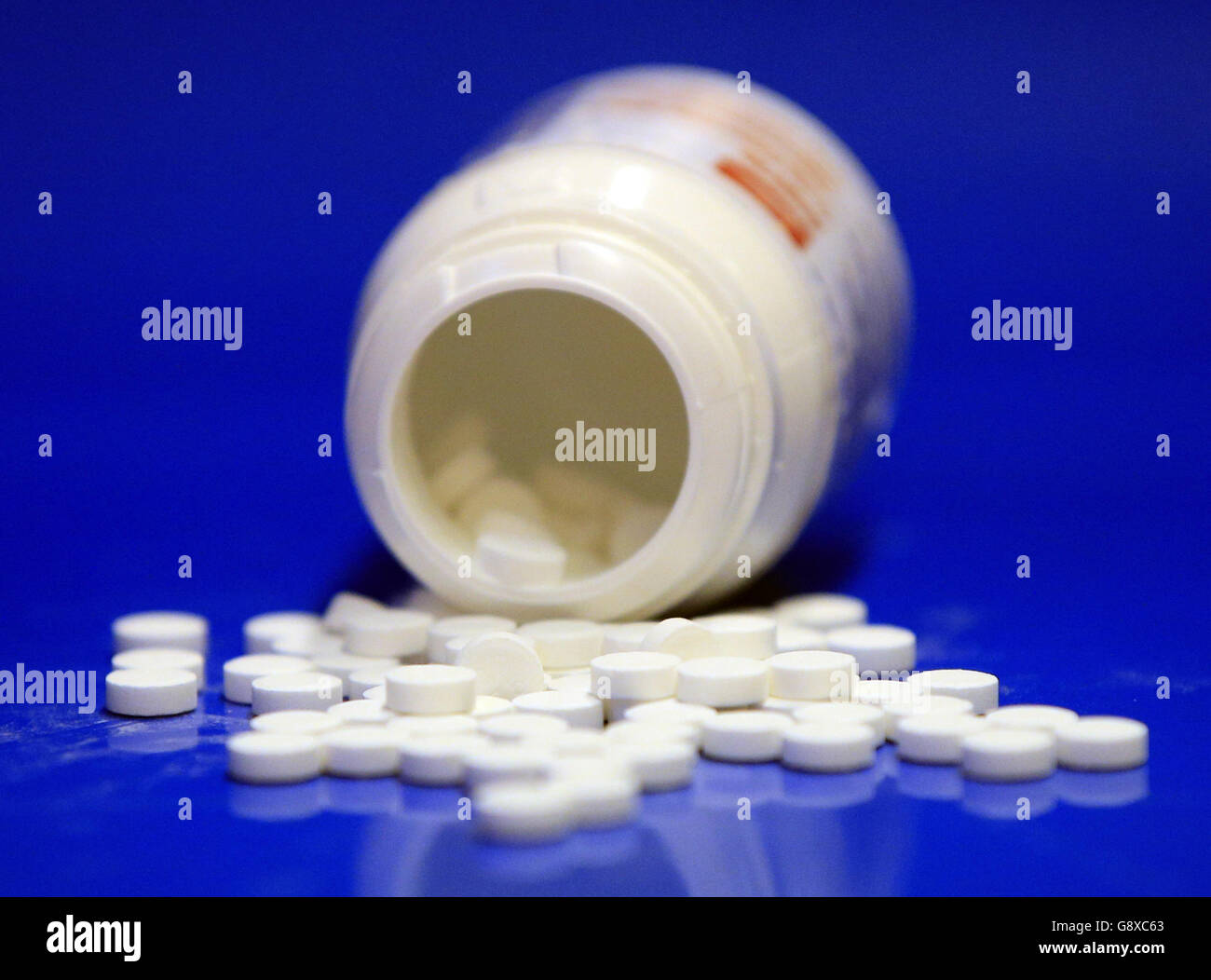 A general view of aspirin tablets and a bottle.. A general view of ...