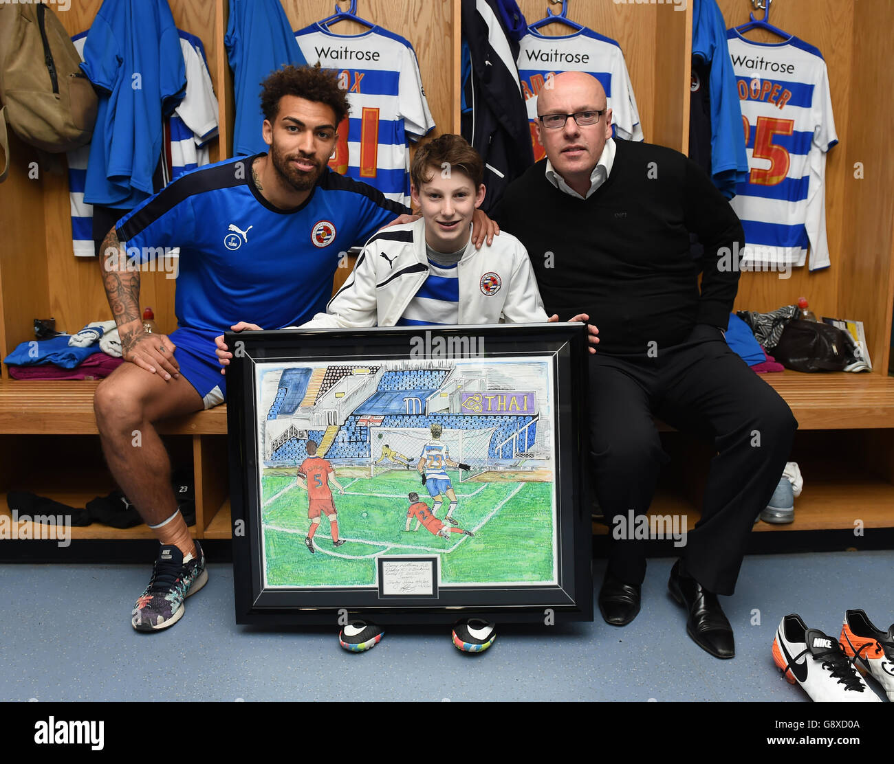 Reading fan Stanley Harris present Reading player Danny Williams with a ...