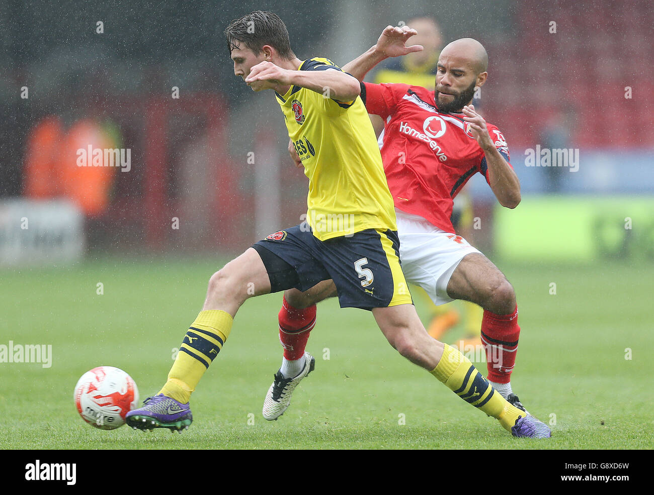 Walsall's Adam Chambers and Fleetwood Town's Eggert Jonsson battle for ...