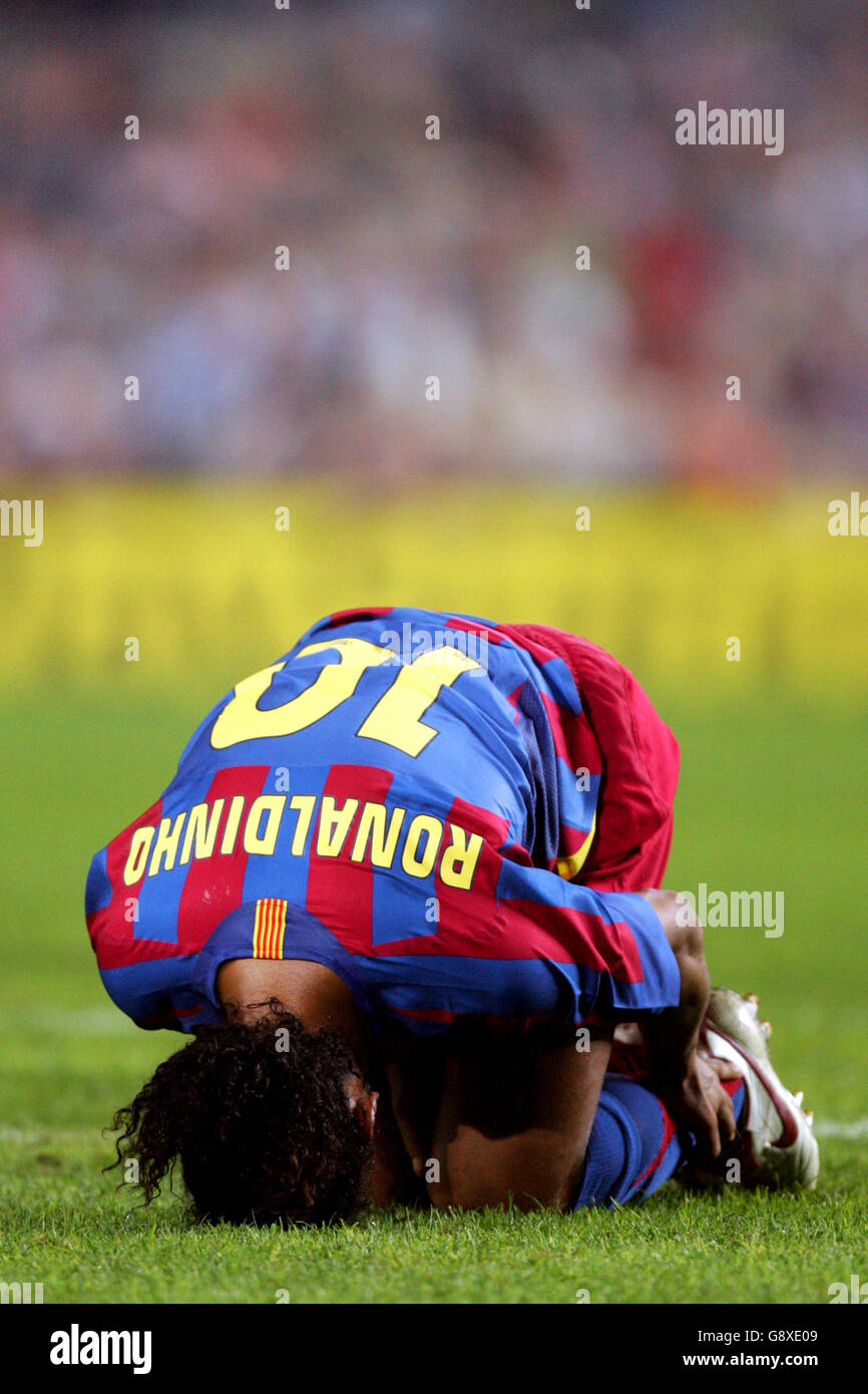 Barcelonas ronaldinho holds his ankle affter being injured hi-res stock ...