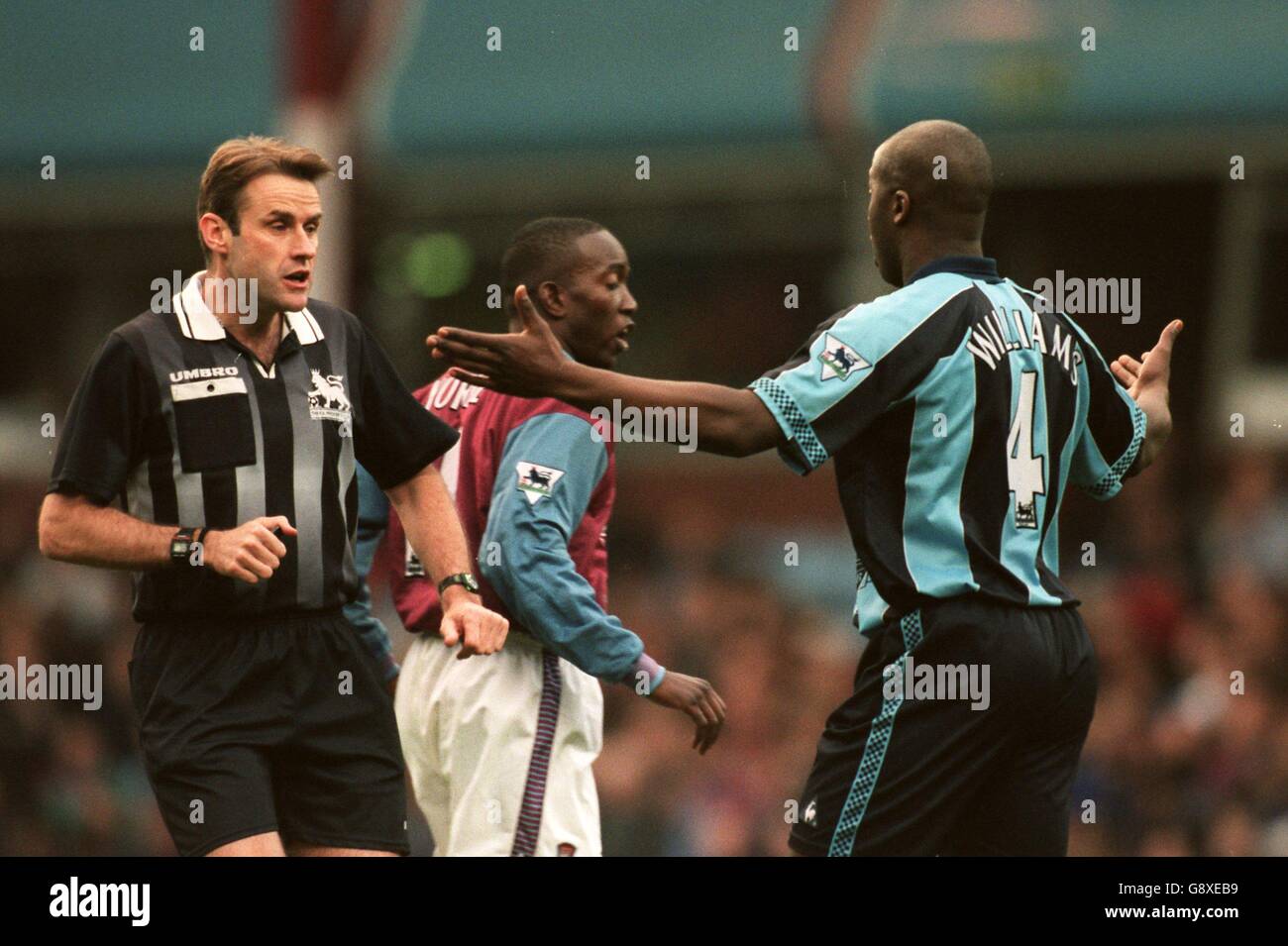 Two half official black stripes football hi-res stock photography and ...