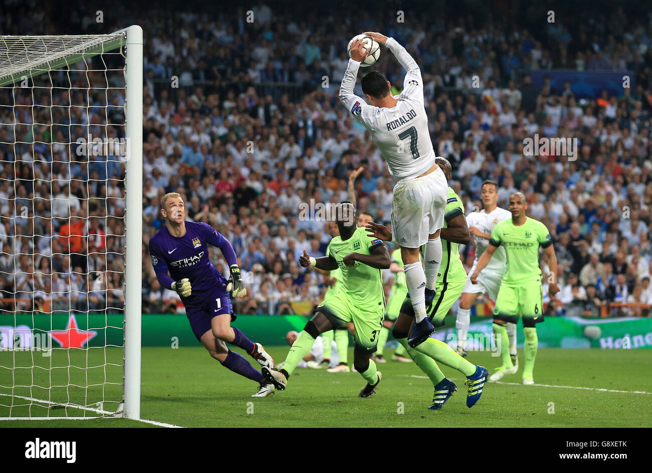 Real Madrid's Cristiano Ronaldo handles the ball into the goal ...