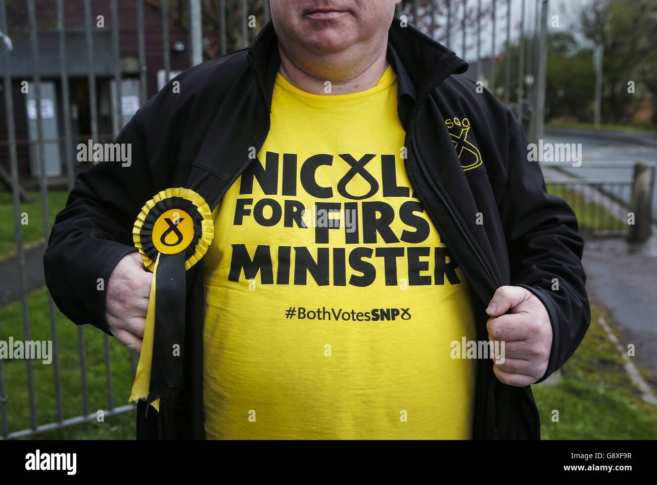 An SNP supporter outside Broomhouse Community Hall polling station in ...