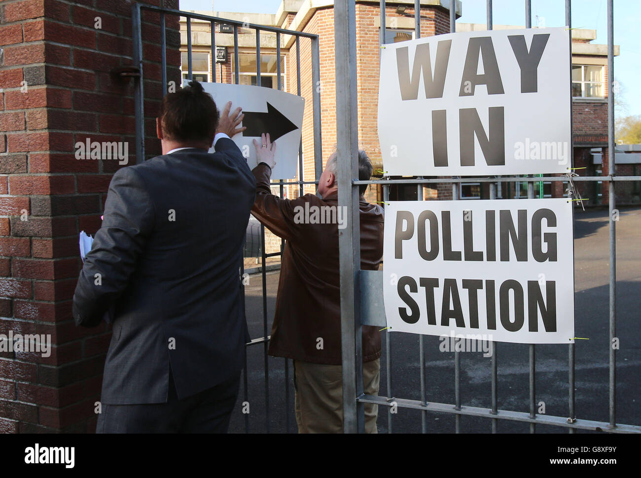 Signs are put outside a polling station at Model Primary School in ...