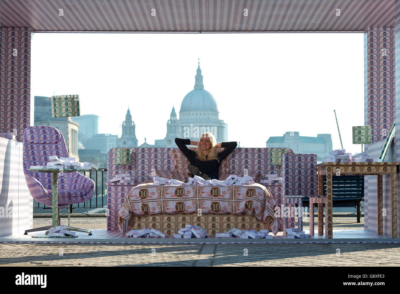 Emma Corbett from London sits in a reconstruction of a hotel room made ...