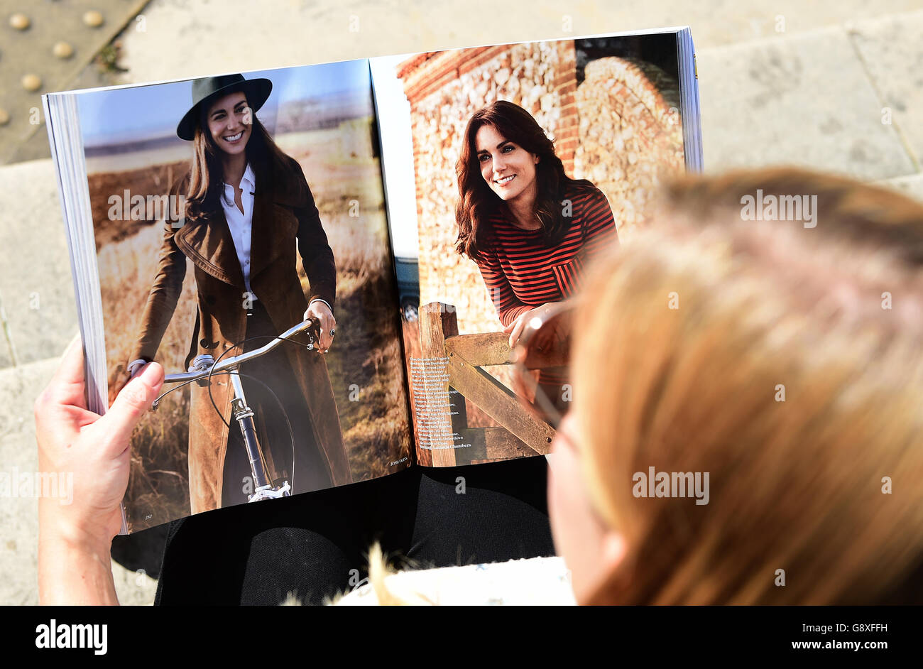 Laura Harding, from London, reads the latest issue of Vogue, featuring ...