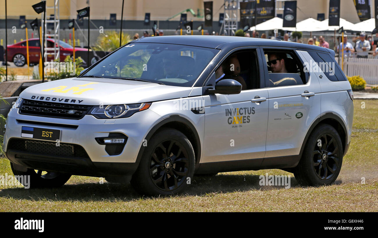 Prince Harry sits in the back of a Land Rover Discovery as he joins the ...