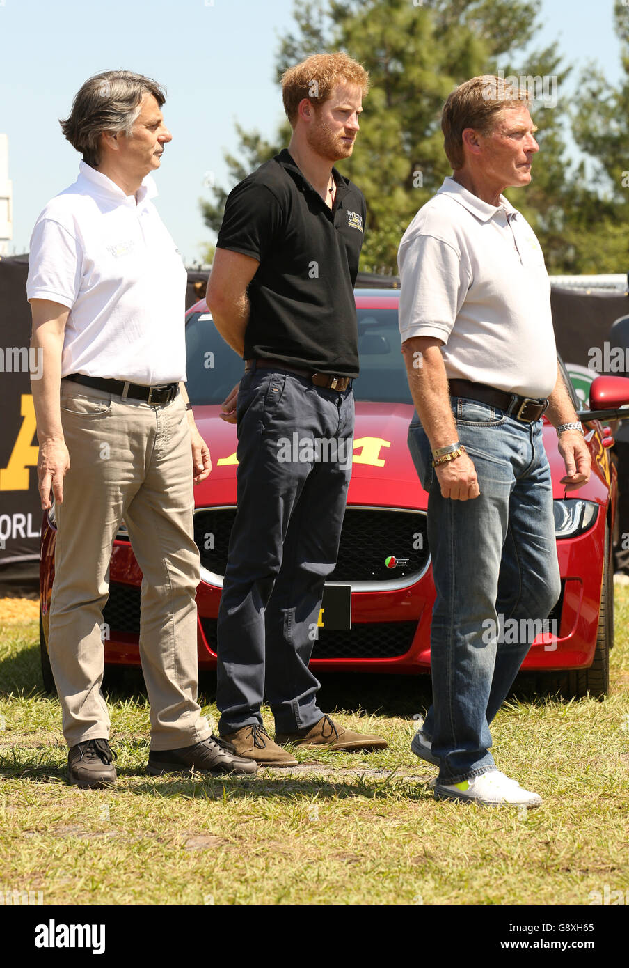 Prince Harry (centre) during the Jaguar Land Rover Discovery challenge ...