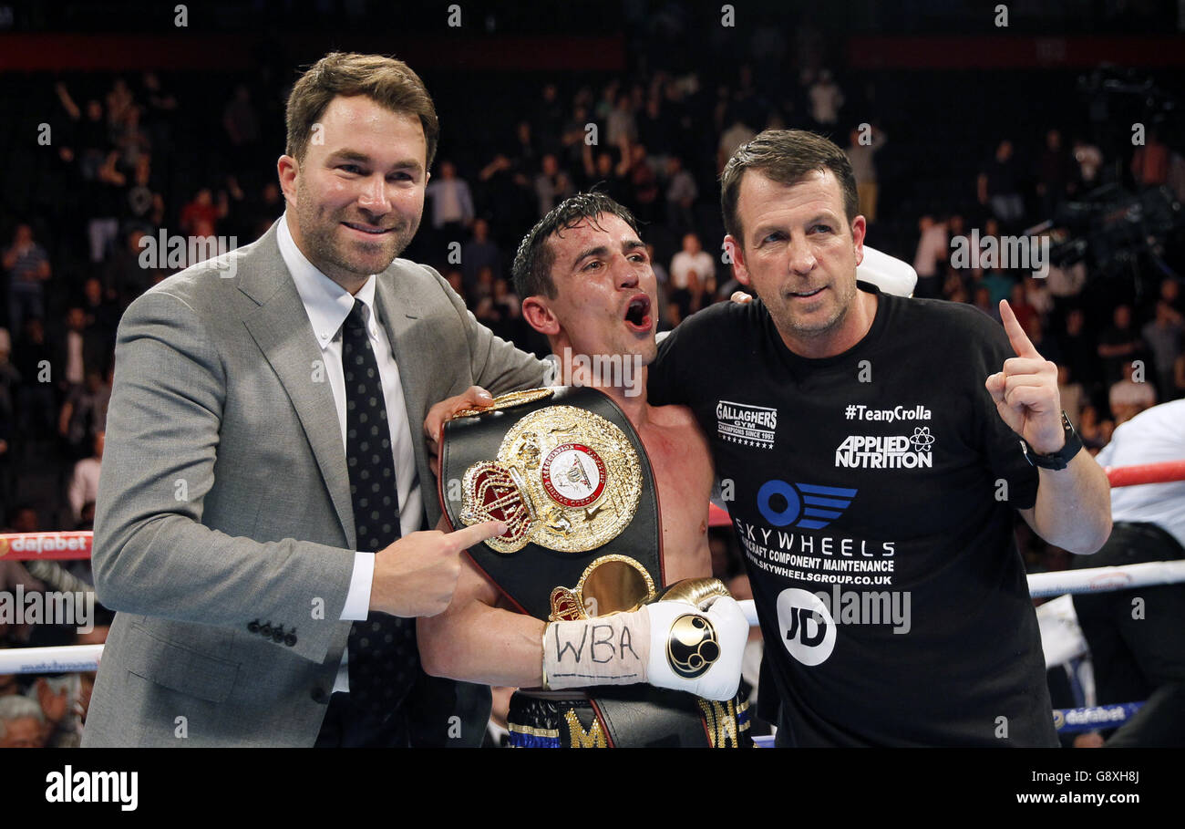 Anthony Crolla celebrates with trainer Joe Gallagher (right) and ...