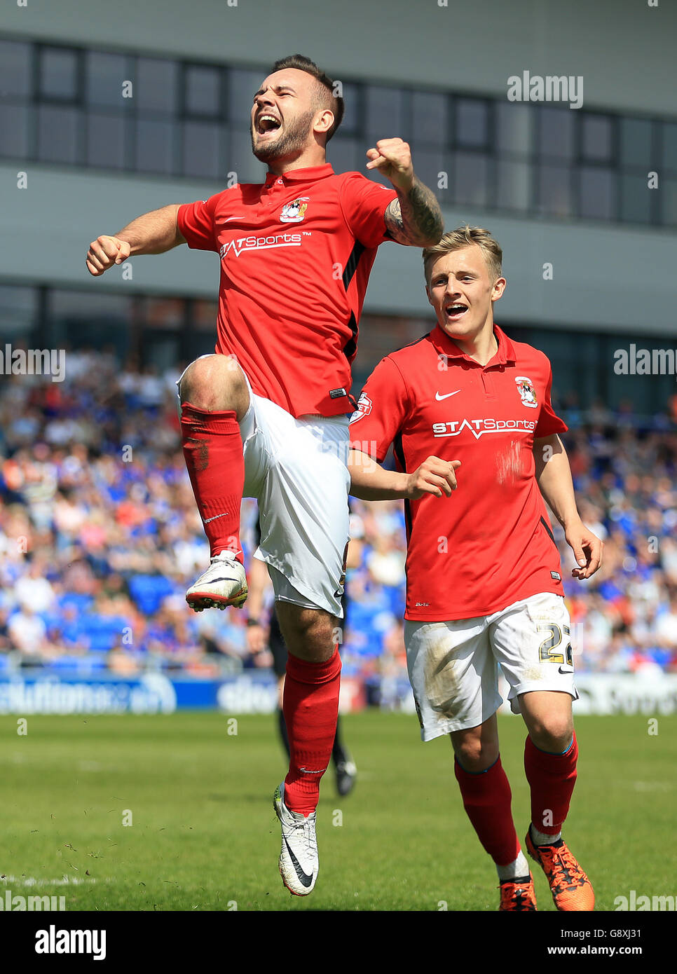Coventry City's Adam Armstrong (Left) celebrates after he scores his ...
