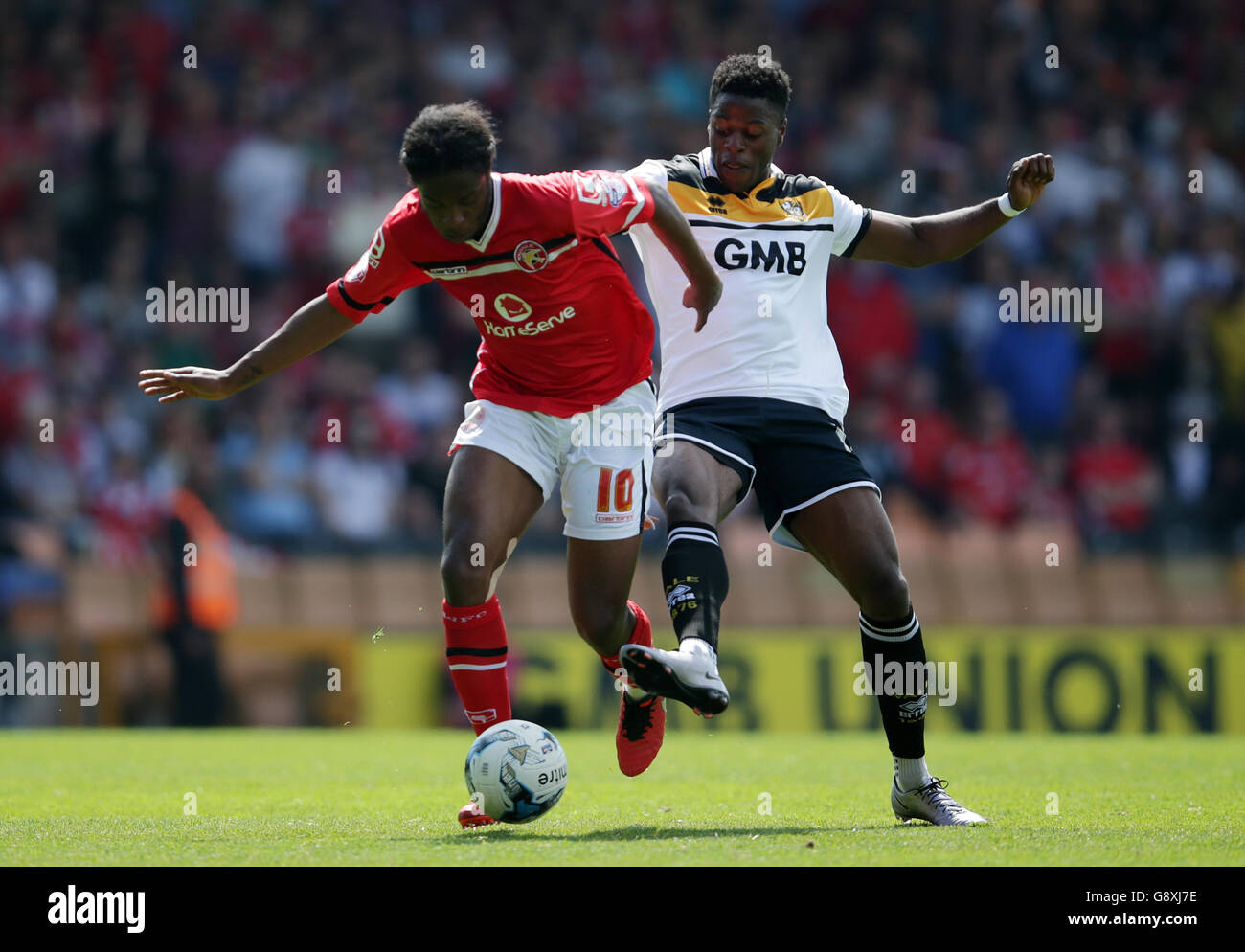 Port Vale's JJ Hooper and Walsall's Romaine Sawyers (left) battle for ...