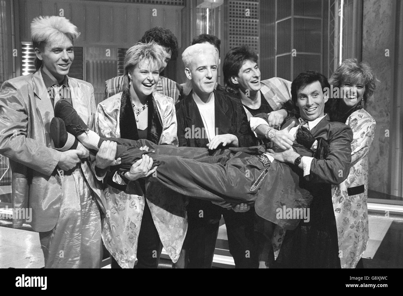 Pop group Ryder hold up their lead singer Maynard Williams with the ...