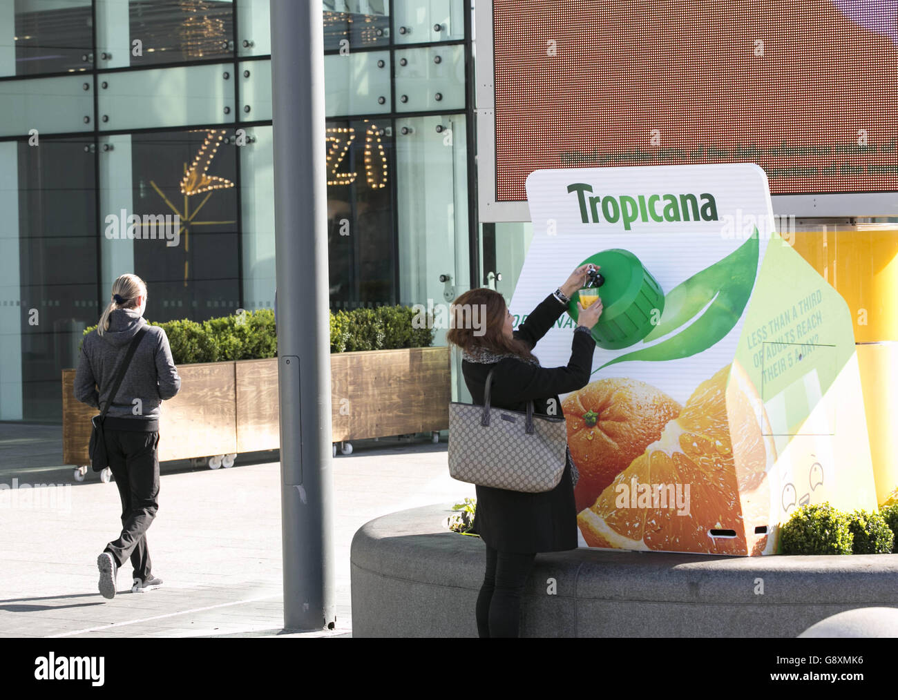 EDITORIAL USE ONLY A 5.2m high interactive juice dispensing billboard ...