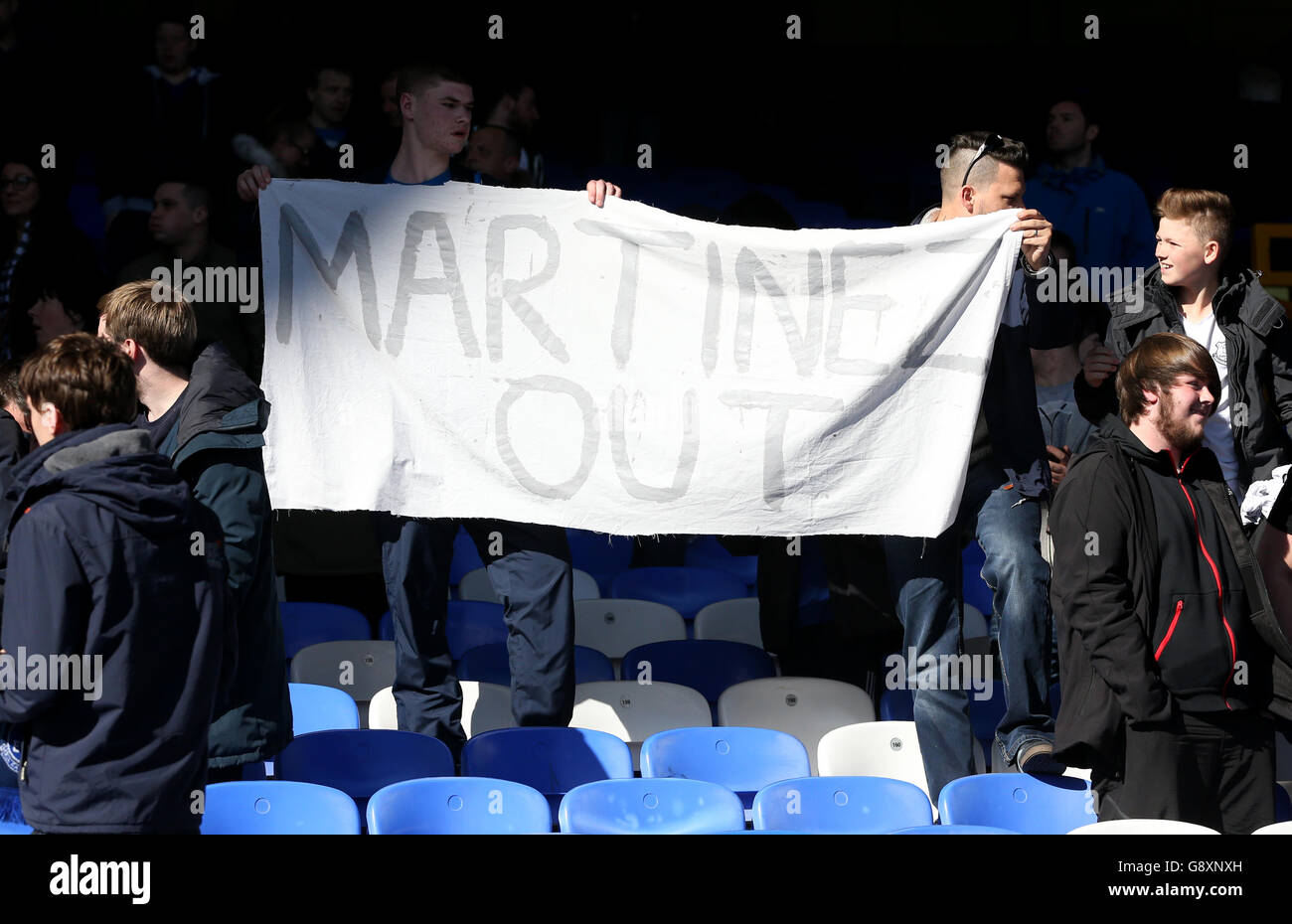 Everton fans hold protest signs in the stands despite victory after the ...