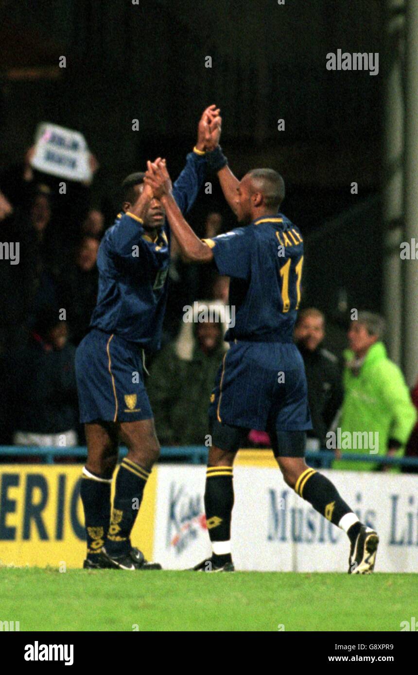 Wimbledon's Robbie Earle (left) and Marcus Gayle (right) celebrate the ...