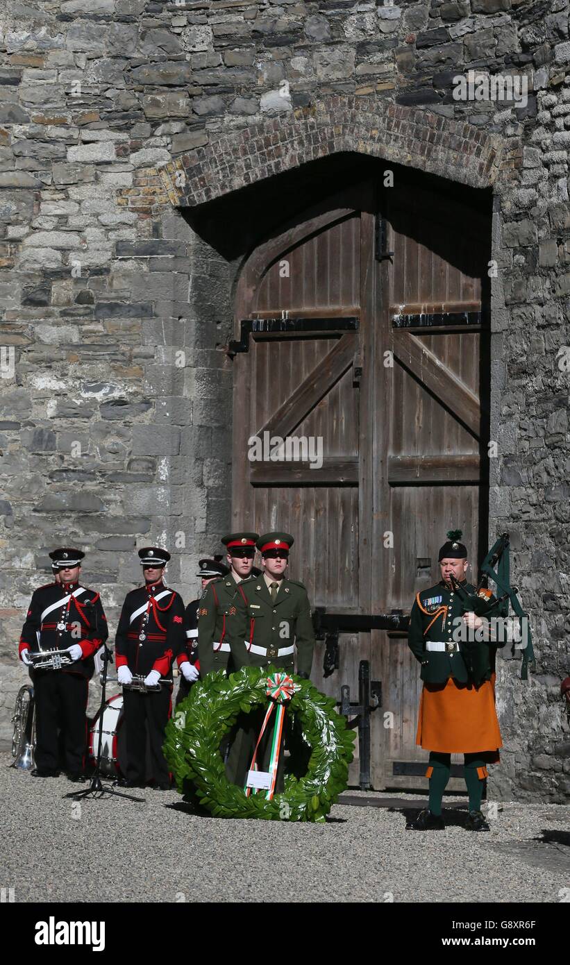 Military Police officers hold wreaths during a ceremony to commemorate ...