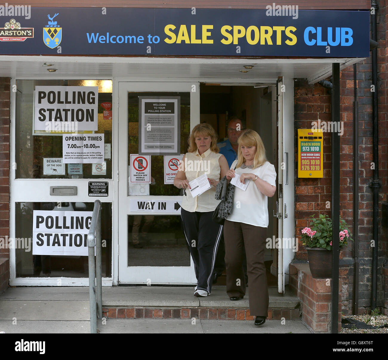 People leave a polling station at Sale Sports Club, Sale, in Trafford ...