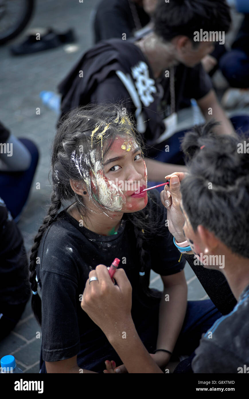 Face paint.Thai teenagers staging a street mocking protest against ...