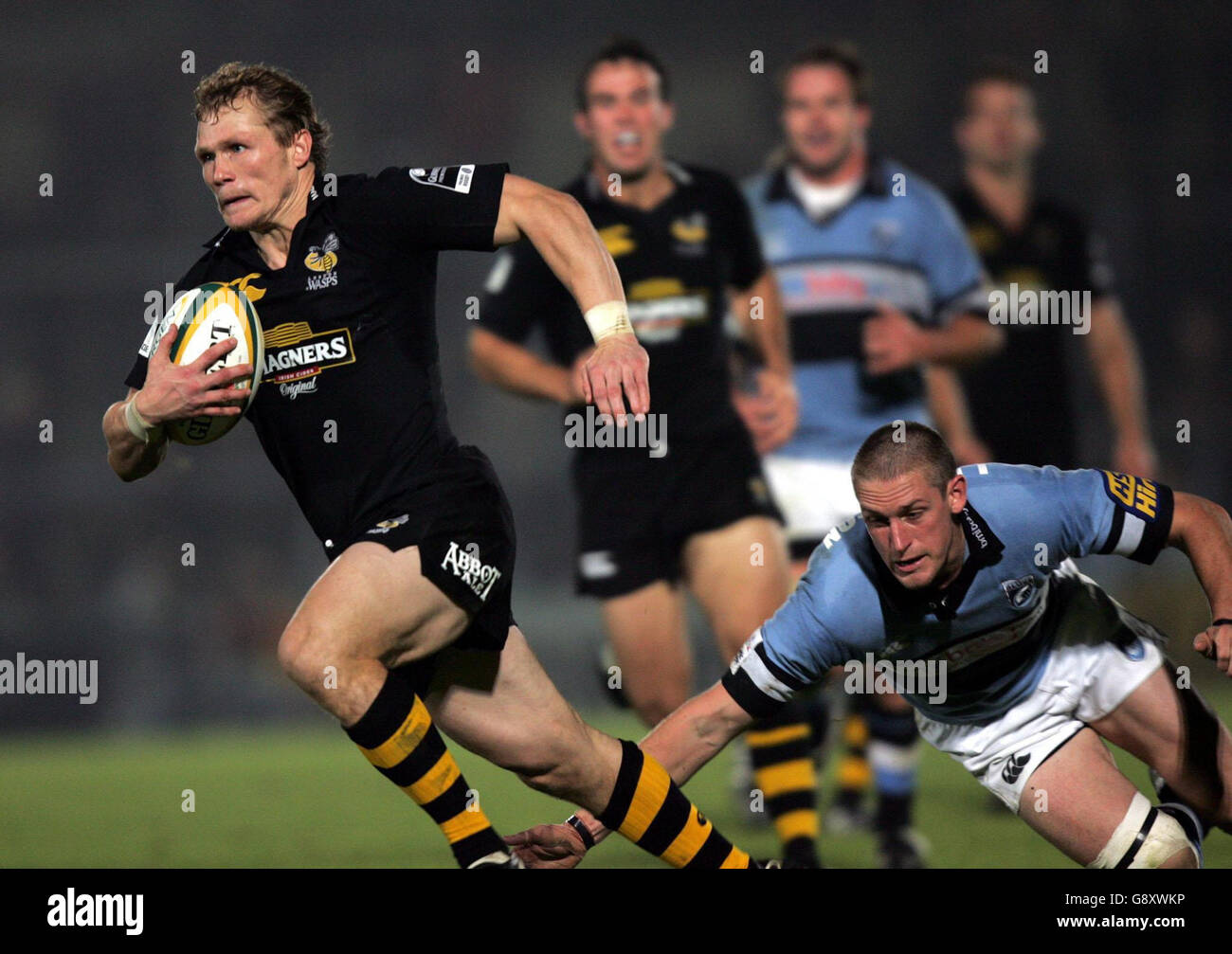 Wasps' Josh Lewsey (L) breaks away from Cardiff's Jamie Robinson to ...