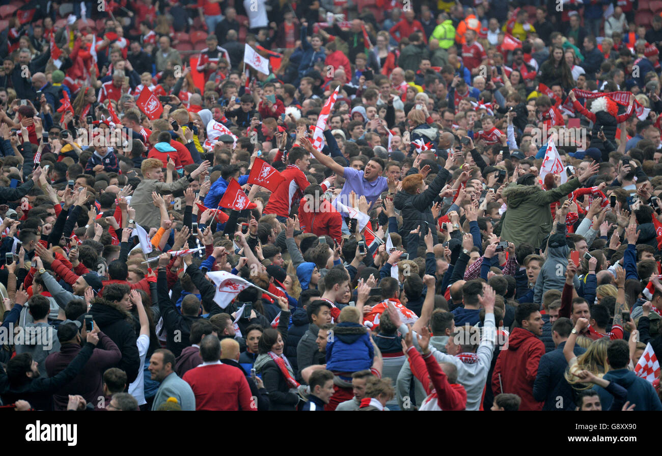 Middlesbrough fans on the pitch celebrate their promotion to the ...