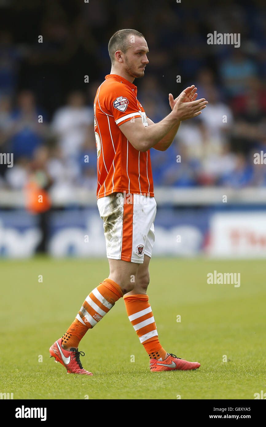 Blackpool's Tom Aldred applauds the travelling support Stock Photo - Alamy
