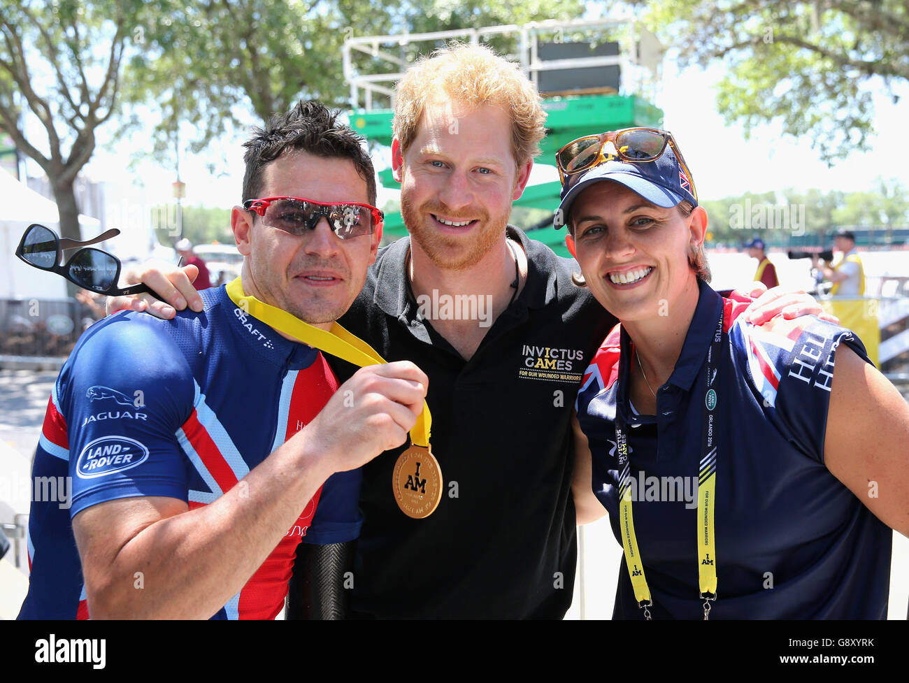 Prince Harry poses with gold medal winner Jaco van Gass (left) at the ...