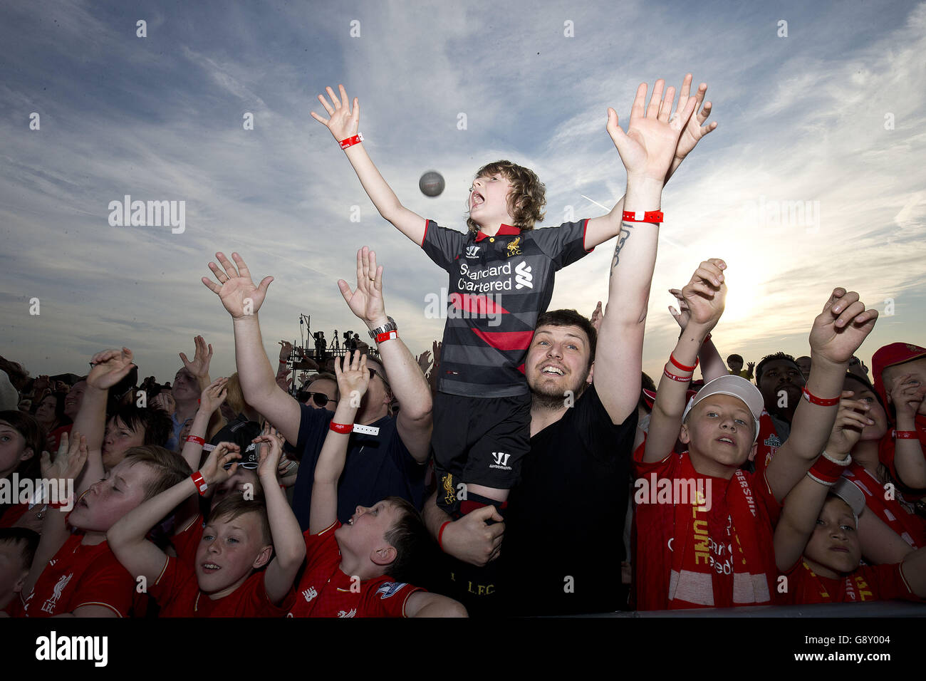 Liverpool's fans shout for signed balls being kicked into the crowd by ...