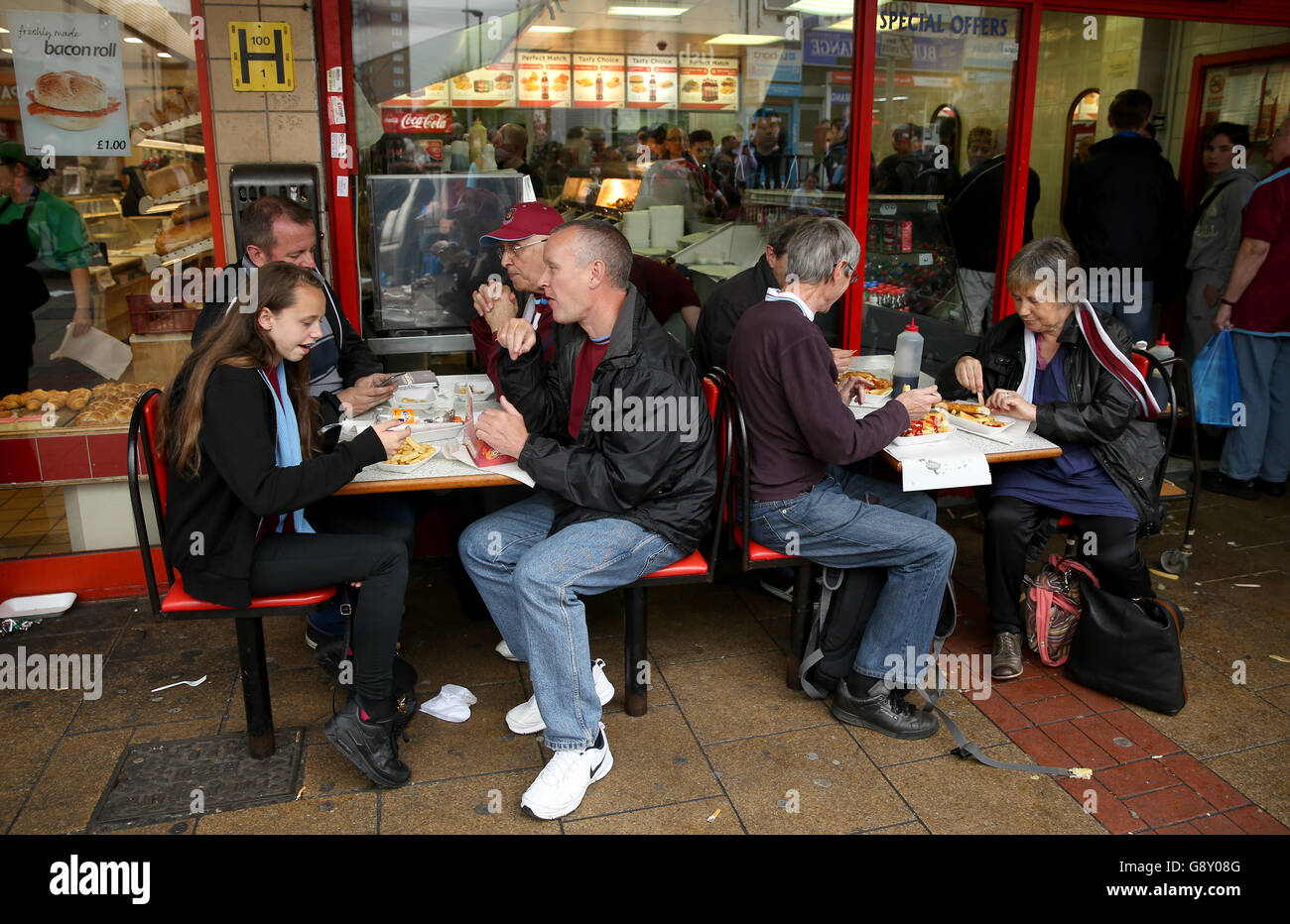 West Ham United fans grab a bite to eat before the final match at Upton ...
