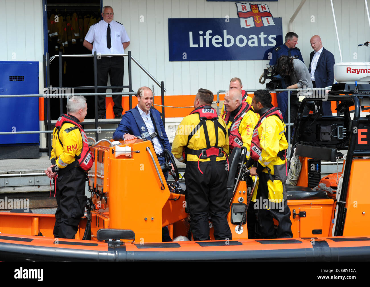 The Duke of Cambridge (second left) speaks to RNLI crew on board a RIB ...