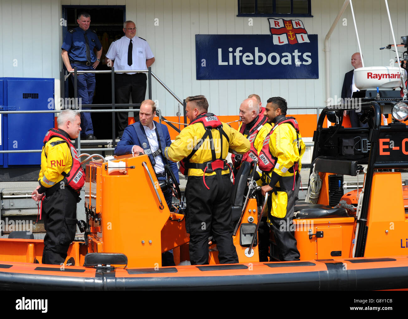 The Duke of Cambridge (second left) speaks to RNLI crew on board a RIB ...