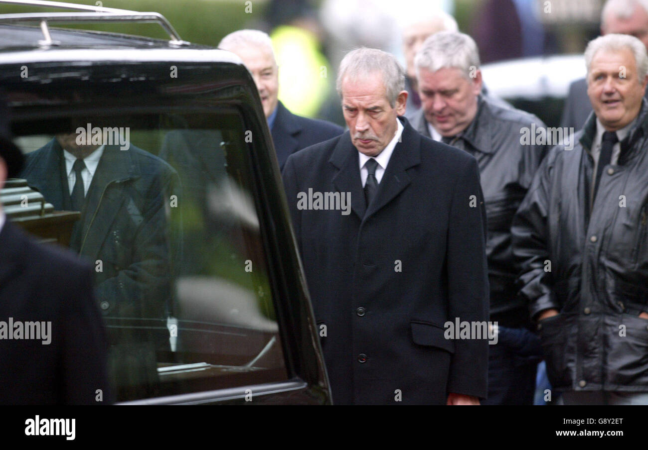 Jim Gray Snr (centre) walks behind the hearse carrying the coffin of ...