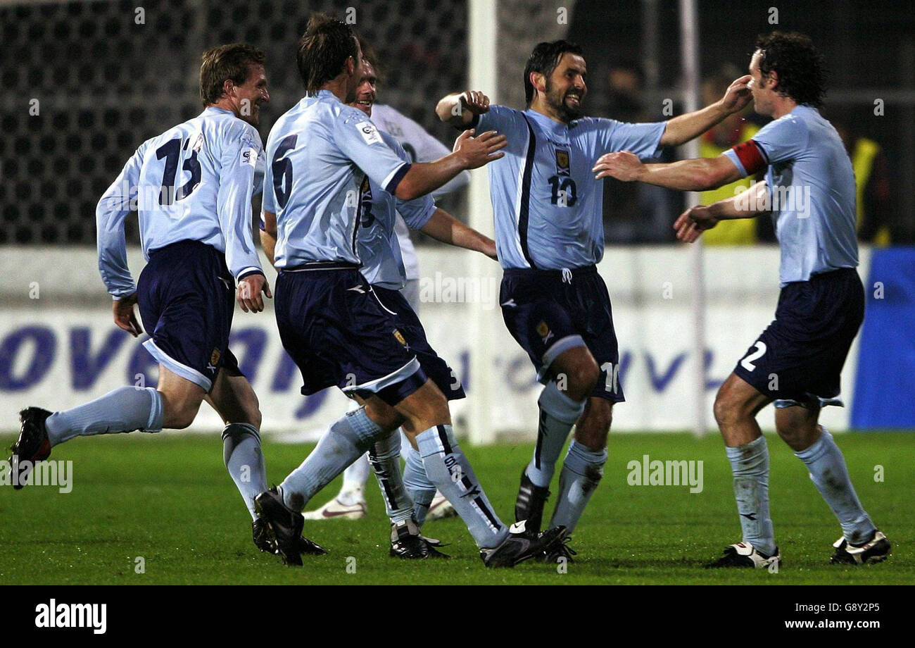 Scotland's Paul Hartley (second right) celebrates scoring against ...