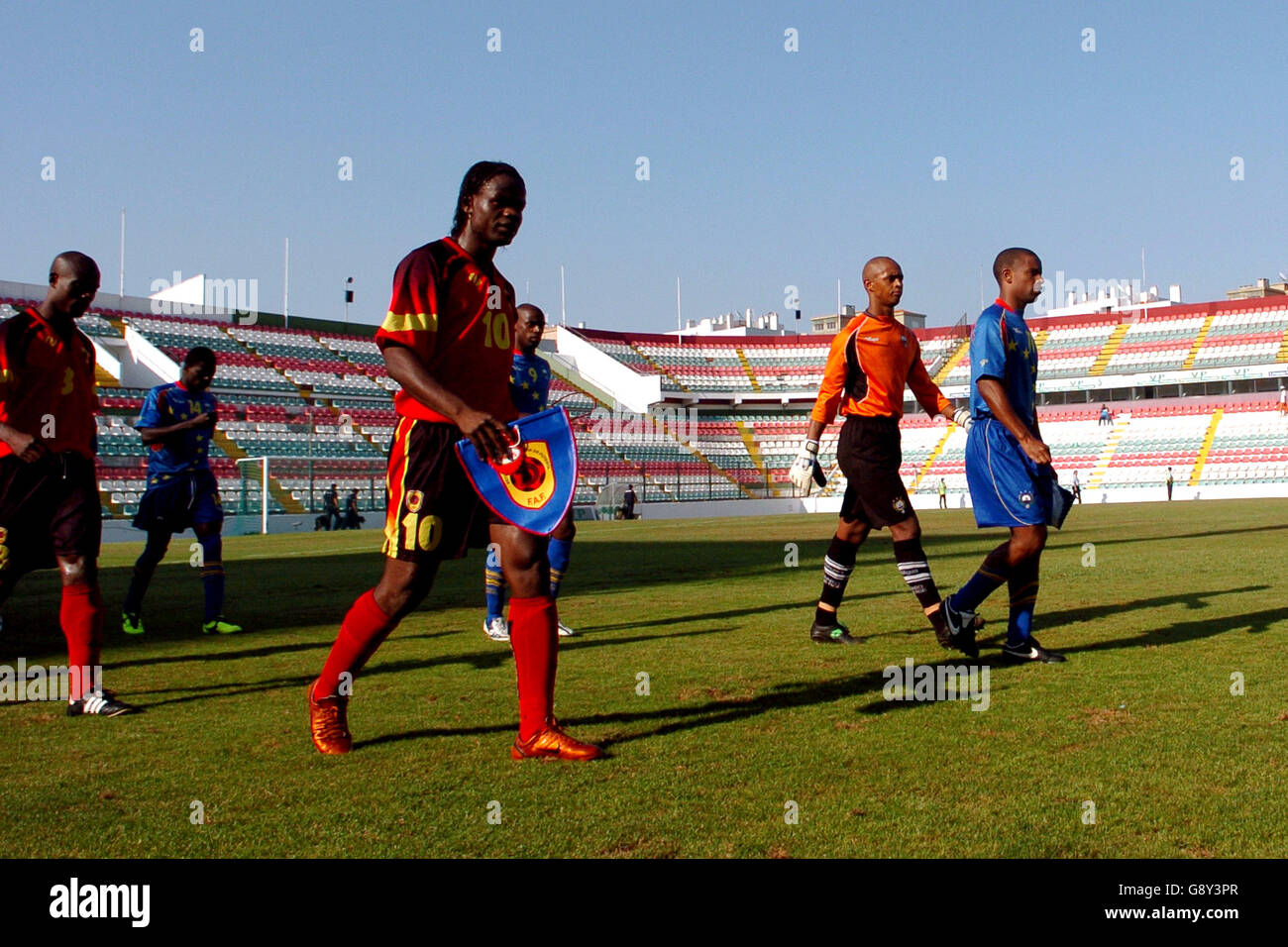 Angolas fabrice maieco akwa leads out his team hi-res stock photography ...