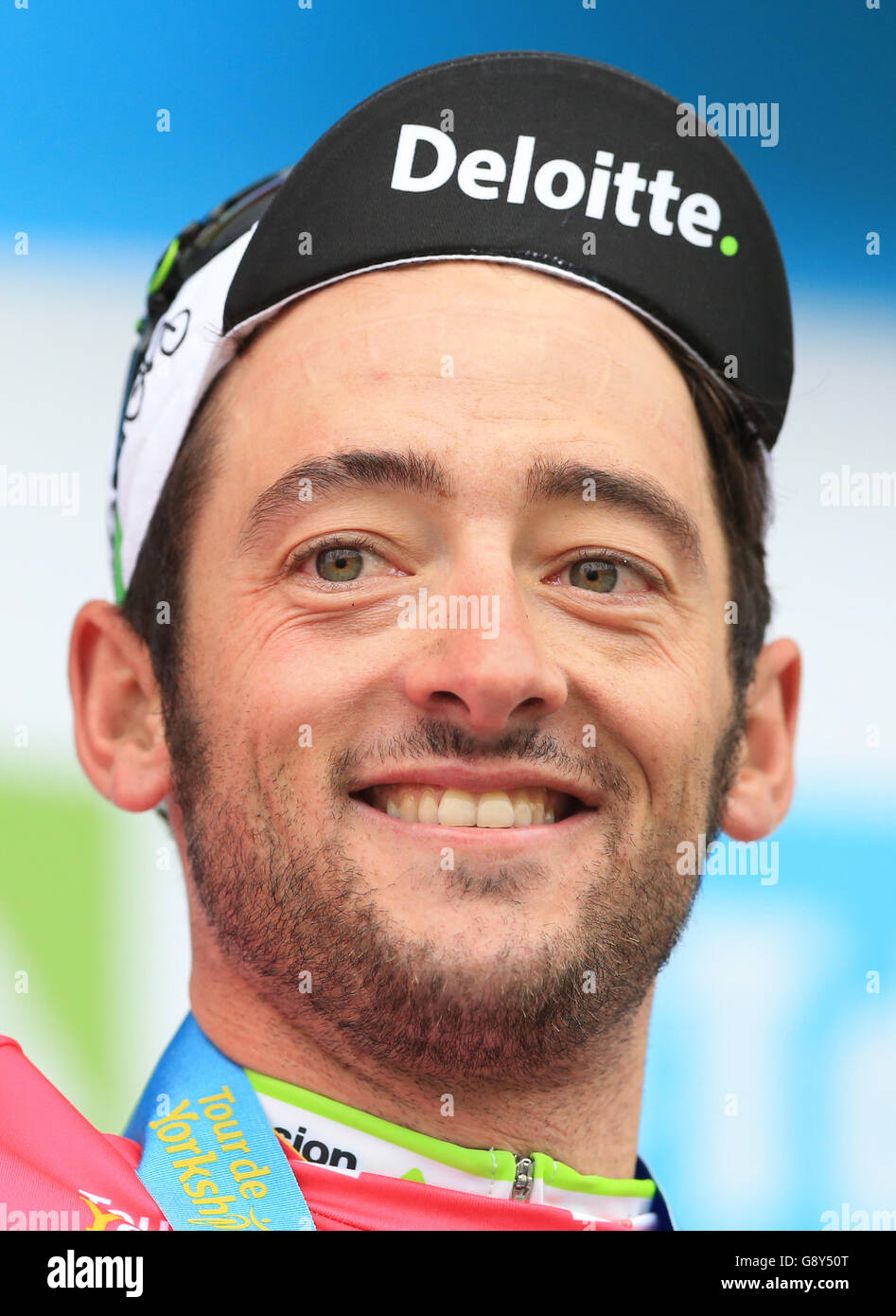 Dimension Data's Nathan Haas is awarded the King of the Moutain jersey ...